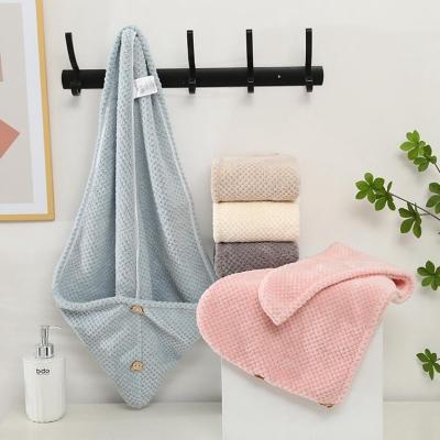 China Microfiber Turbie Twist Hair Towel 25x66cm Coral Fleece Waffle Weaving 240-560gsm Customizable for sale