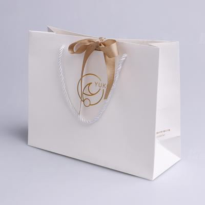 China Glitter Rose Gold Gift Bag White Gloss Custom High-end Ribbon Gift Bag for sale