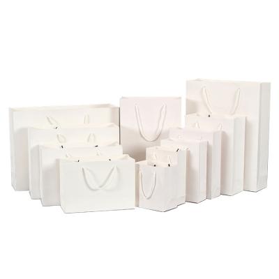 China Custom Logo Printed Luxury High End White Paper Jewelry Clothing Packaging Gift Shopping Bag for sale
