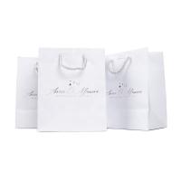 China Creatrust Custom Gift Paper Bag Handle Paper Bags Brand Logo Luxury Boutique Shopping White Kraft Paper Customized CMYK Accept for sale
