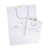 China Creatrust Custom Gift Paper Bag Handle Paper Bags Brand Logo Luxury Boutique Shopping White Kraft Paper Customized CMYK Accept for sale