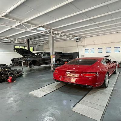 China 9900lbs Capacity Two Post Car Lift with Barrier Free Base and Manual Release 220V 380V for sale