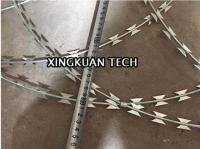 China 20cm space Flat Wrap Razor Wire 900mm Coil Diameter for fence for sale