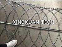China 20cm space Flat Wrap Razor Wire 900mm Coil Diameter for fence for sale