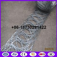China 450mm coil diameter Razor wire flat wrap coils as a clapped into a flat panel formation. for sale