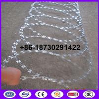 China 450mm coil diameter Razor wire flat wrap coils as a clapped into a flat panel formation. for sale