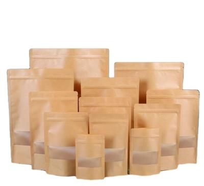 China Custom Printing Food Packaging Bags Brown Kraft Stand Up Pouch With Window for sale