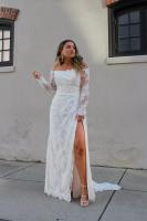 China Ultra-romantic Long Sleeve Off-the-shoulder Neckline Thigh-high Slit Sheath Sweep Train Zipper White Lace Wedding Dress for sale