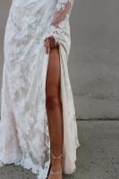 China Ultra-romantic Long Sleeve Off-the-shoulder Neckline Thigh-high Slit Sheath Sweep Train Zipper White Lace Wedding Dress for sale