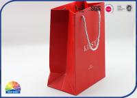 China Recycled Luxury Handle Glossy Kraft Paper Gift Bag With Custom Logo for sale