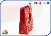 China CMYK 4C Printed Customized Paper Gift Bags Resuable Eco Friendly With Ribbon Handle for sale