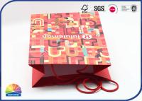 China CMYK 4C Printed Customized Paper Gift Bags Resuable Eco Friendly With Ribbon Handle for sale