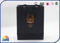 China Black Customized Lion Logo Paper Gift Bag Gold Hot Stamping With Silk Handle for sale