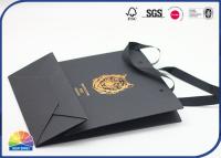 China Black Customized Lion Logo Paper Gift Bag Gold Hot Stamping With Silk Handle for sale