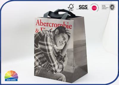 China 210gsm Matte Lamination Coated Paper Bag Embossing Customized Logo With Handle for sale