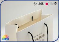 China Custom Logo Paper Shopping Bags Luxury Boutique Gift Paper Bag With Handle for sale