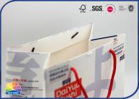 China Luxury Apparel Gift Paper Shopping Bags With Nylon Twisted Shoe Buckle Handle for sale