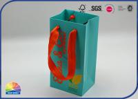 China Eco Friendly Pantone Print Green Paper Gift Shopping Bag With Orange Handle for sale