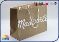 China Brown Printed Kraft Paper Gift Bag Package With Knotted Handle for sale