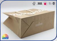 China Brown Printed Kraft Paper Gift Bag Package With Knotted Handle for sale