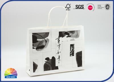 China Custom Printed White Kraft Paper Gift Bags With Twisted String Handles for sale