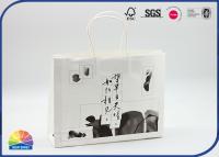 China Custom Printed White Kraft Paper Gift Bags With Twisted String Handles for sale