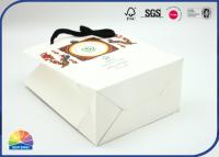 China 190gsm Solid Colored Art Paper Gift Bag With Ribbon Handle For Christmas Treat Bags for sale