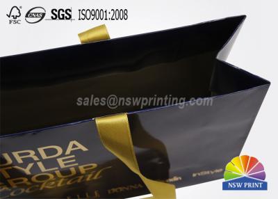 China Glossy Laminated Full Color Printed Custom Paper Garment Bags with Ribbon Handle for sale
