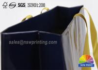 China Glossy Laminated Full Color Printed Custom Paper Garment Bags with Ribbon Handle for sale