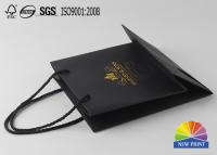 China Durable Black Cardboard Printed Paper Bags With Brand Monogram Gold Foil Stamping for sale