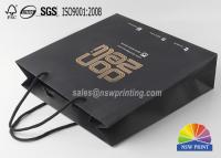 China Custom Hot Stamping Logo Luxury Black Cardboard Paper Packaging Bag For Clothes for sale