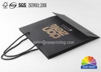 China Custom Hot Stamping Logo Luxury Black Cardboard Paper Packaging Bag For Clothes for sale