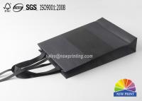 China New Design Luxury Spot UV-coating Logo Black Cardboard Paper Bag With Ribbon Handle for sale