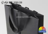 China New Design Luxury Spot UV-coating Logo Black Cardboard Paper Bag With Ribbon Handle for sale