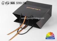 China Ribbon Decoration Luxury Black Gift Paper Bags With Logo Hot Gold Stamping for sale