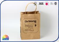 China Stand Up Packaging Kraft Paper Bags Black Printing With Handles for sale