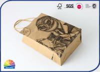 China Stand Up Packaging Kraft Paper Bags Black Printing With Handles for sale