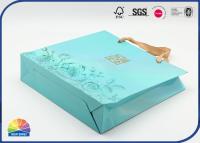 China 4C Printed Kraft Paper Gift Bags Logo Gold Stamping With Ribbon Handles 80gsm for sale