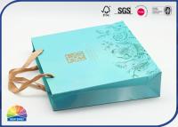 China 4C Printed Kraft Paper Gift Bags Logo Gold Stamping With Ribbon Handles 80gsm for sale
