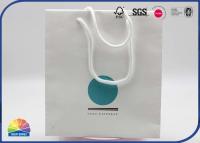 China 180gsm Biodegradable Printed Kraft Paper Shopping Bags With Handles for sale