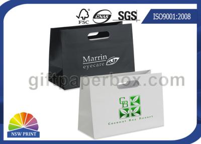 China Hot Stamping Die Cut Handle Printed Paper Bags White Or Black With Art Paper for sale