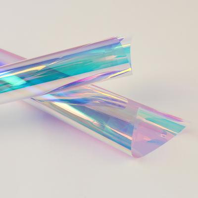 China Factory Wholesale Color Laser Paper Blue Base Golden Light PET Rainbow Film Iridescent Film Roll Translucent Material for Decoration Packaging for sale