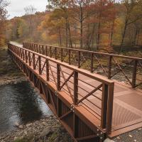 China Prefabricated Weatherproof Steel Pedestrian Bridge 50-150 kg/m² Bolted Connections Custom Width for sale
