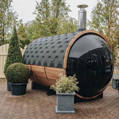 China Outdoor Panoramic Window Cedar Barrel Sauna Room With Wooden Fired Stove for sale