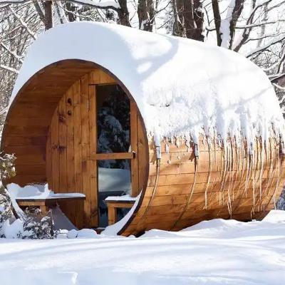 China Canadian Red Cedar Wood Outdoor Sauna Steam Barrel Sauna With Wood Stove for sale