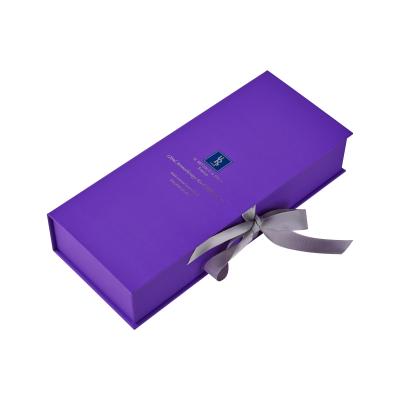 China Luxury Purple Magnetic Aromatherapy Box With Silver Foil Logo Ribbon Bow For Essential Oil for sale