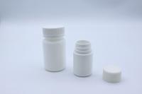 China 70ml PE Plastic Empty White Capsule Bottle With Child Resistant Cap for sale