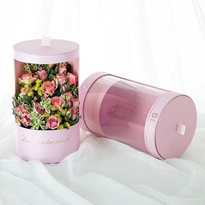 China CMYK Printed Cylinder Shape Gold Stamping Logo Pink Flower Packaging Box for Roses for sale