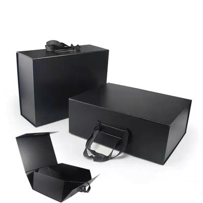 China Magnetic Flip Rigid Cardboard Packaging Black Kraft Boxes 20x18x6 for sale
