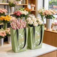 China Biodegradable Paper Bag with Twisted Paper Handles and Gravure Printing for Retail Packaging Paper Carrier Bag for sale